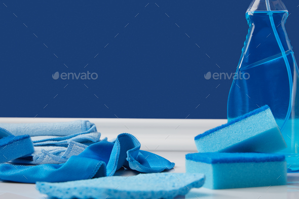 blue spray, rags and washing sponges for spring cleaning on floor Stock ...