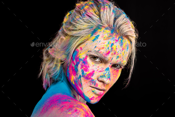 attractive fashionable girl posing in colorful holi powder, isolated on ...