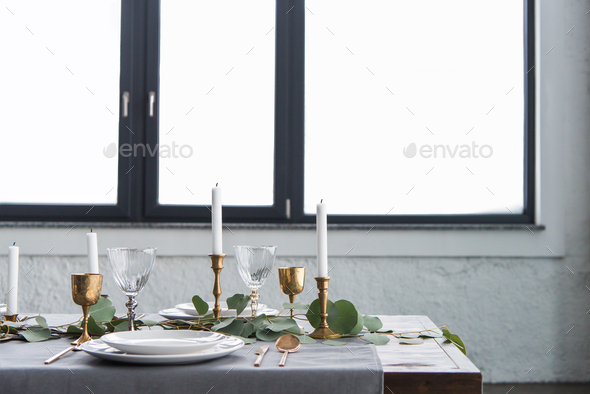 close up view of rustic table arrangement with eucalyptus, vintage ...