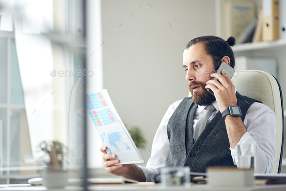 Sales forecasting expert calling customer Stock Photo by Media_photos