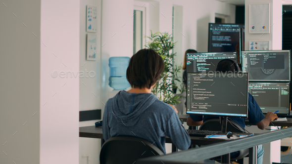 Multiethnic group of programers working on server code to develop new database Stock Photo by DC ...