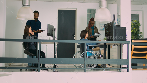 Multiethnic group of programmers collaborating on it project to create algorithm Stock Photo by ...