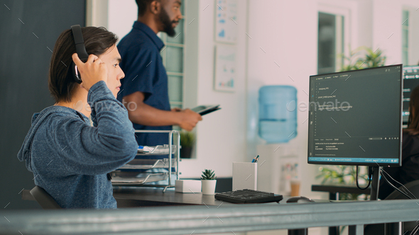 Software engineer working on user interface and writing code with html ...