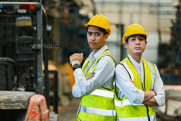 Portrait two engineers, Worker wear uniform and helmet arm crossed ...