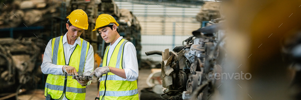 Teamwork engineers, Worker wear uniform and helmet talk and using tablet for work in warehouse ...