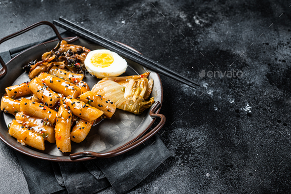 Tteokbokki, Topokki stick rice cake in Hot and spicy sauce with egg and ...