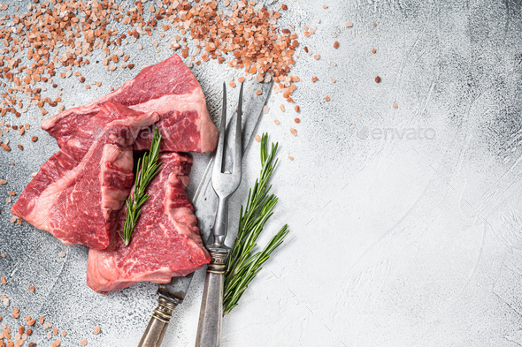 Silverside sirloin beef cut, raw meat on butcher table with herbs ...