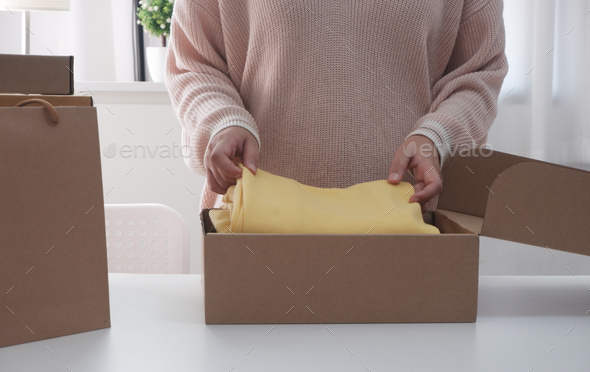 Women packing Cardboard Parcel Box for Online Selling. Woman Seller ...