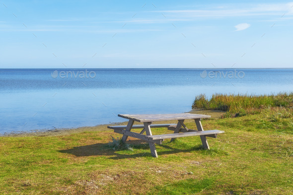 Public bench. Public table and bench at the beach. Stock Photo by ...