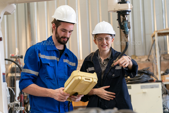 Business industry technology, people and tech. Engineer working maintenance in factory warehouse ...