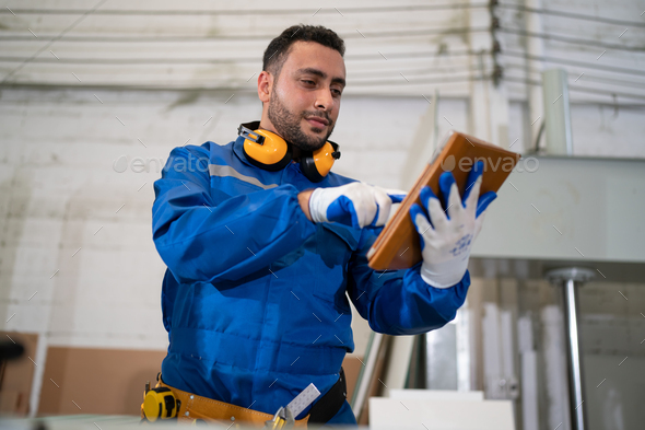 Carpenters Assembling Furniture Business. Young man in production of ...