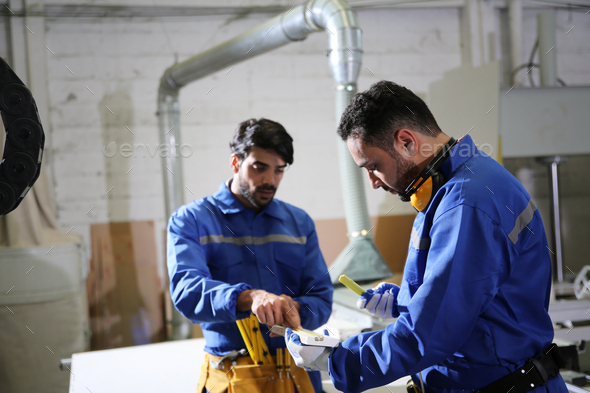 Carpenters Assembling Furniture Business. Young man in production of ...