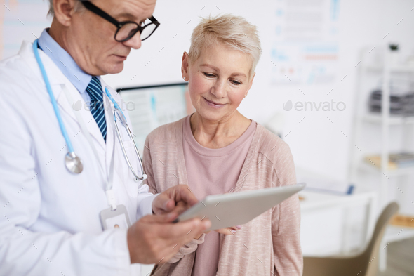 Answering patients questions according to test results Stock Photo by ...