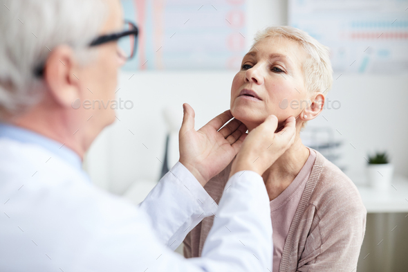 Doctor checking size of lymph nodes Stock Photo by Media_photos | PhotoDune