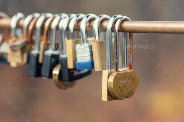 Heart shape love locks on bridge. Padlocks as symbol love and affection ...