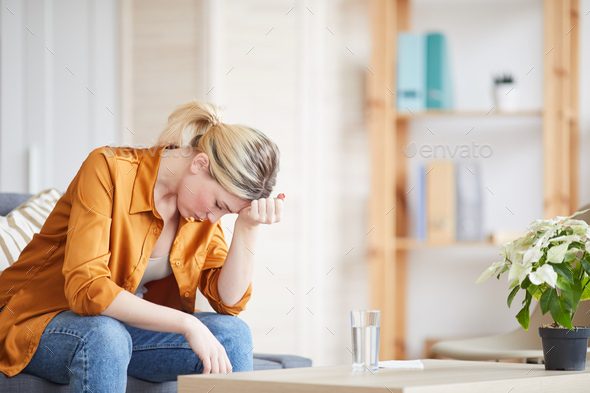 Sad woman at home Stock Photo by Media_photos | PhotoDune