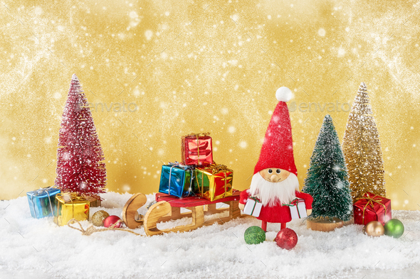 Santa Claus background with Christmas decoration and snow on golden ...