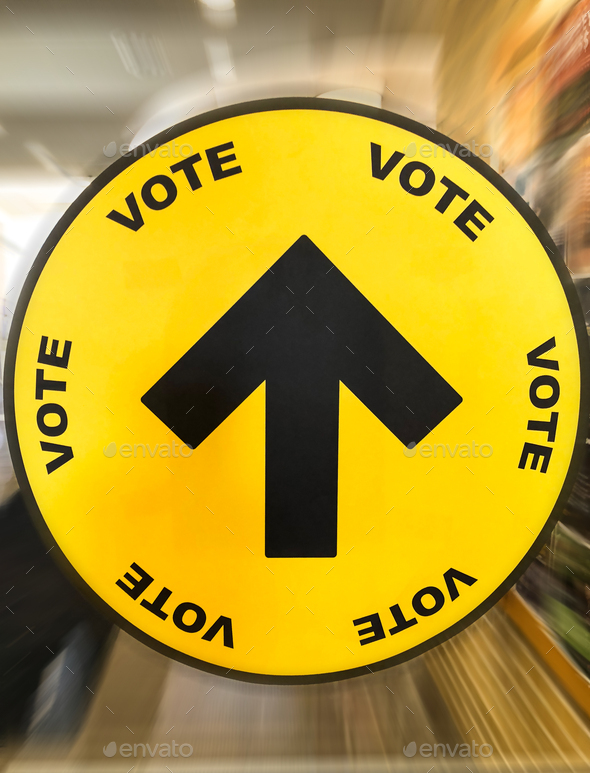Round Vote directional sign with arrow pointing straight ahead Stock ...