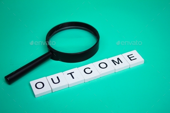 magnifying glass and the word outcome with a blurred green background ...
