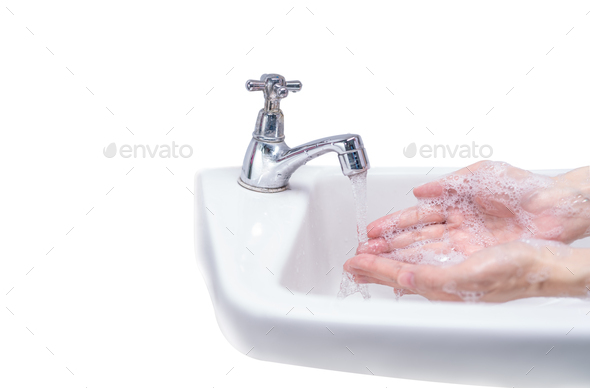 Woman washing hand with soap foam and tap water in bathroom. Hand clean ...