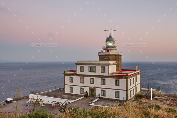 Finisterre lighthouse at sunset. Costa da Morte in Galicia. Spain Stock ...