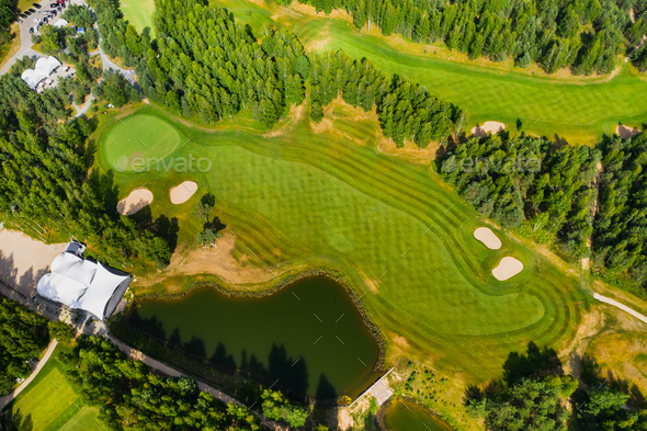 Top view of the golf course located in a wooded area Stock Photo by ...