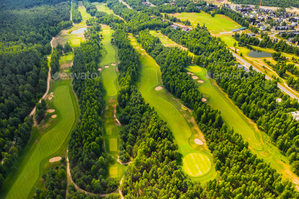 Top view of the golf course located in a wooded area Stock Photo by ...