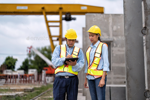 At building construction site senior engineer and supervisor check ...