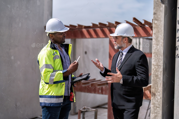 At construction site manager meet senior civil engineer check project ...