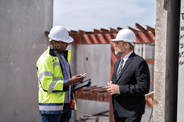 At construction site manager meet senior civil engineer check project ...