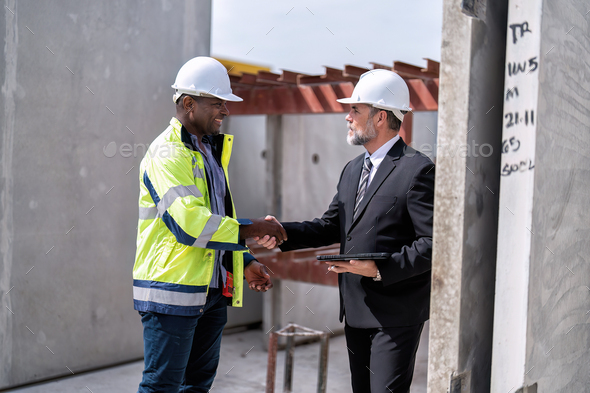 At construction site manager meet senior civil engineer check project ...