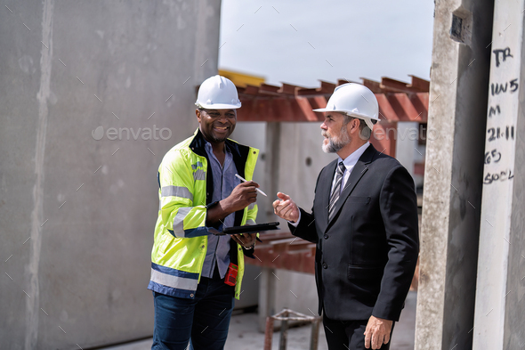 At construction site manager meet senior civil engineer check project ...