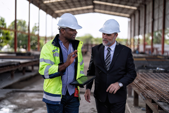 At construction site manager meet engineer check precast concrete slabs ...