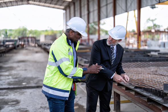 At construction site manager meet engineer check precast concrete slabs ...