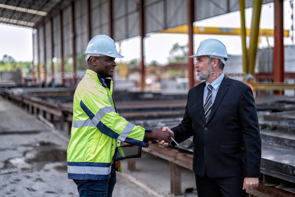 At construction site manager meet engineer check precast concrete slabs ...