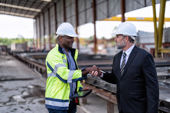 At construction site manager meet engineer check precast concrete slabs ...