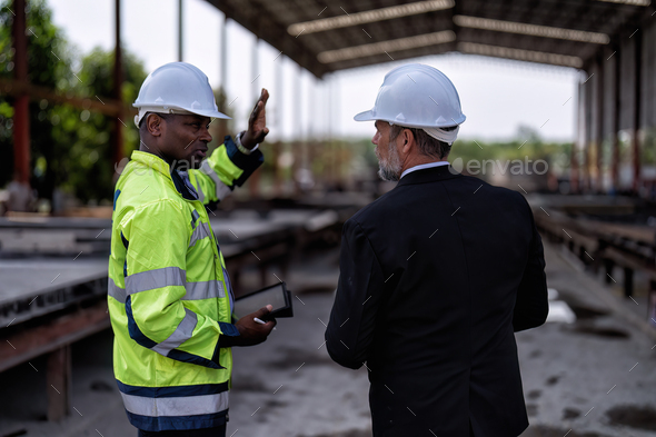 At construction site manager meet engineer check precast concrete slabs ...