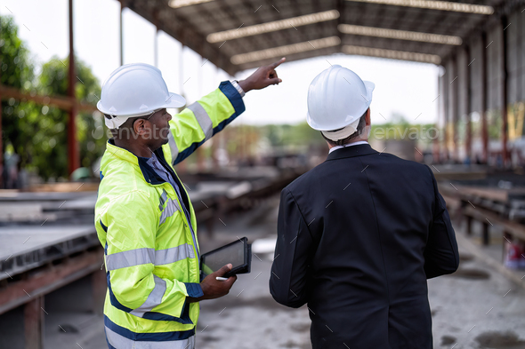 At construction site manager meet engineer check precast concrete slabs ...