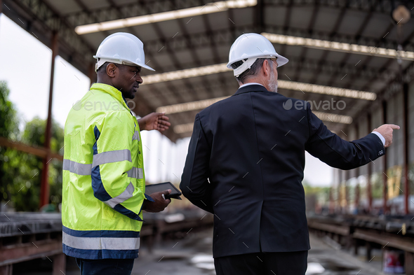 At construction site manager meet engineer check precast concrete slabs ...