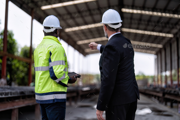At construction site manager meet engineer check precast concrete slabs ...