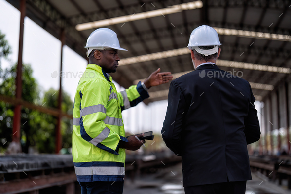 At construction site manager meet engineer check precast concrete slabs ...