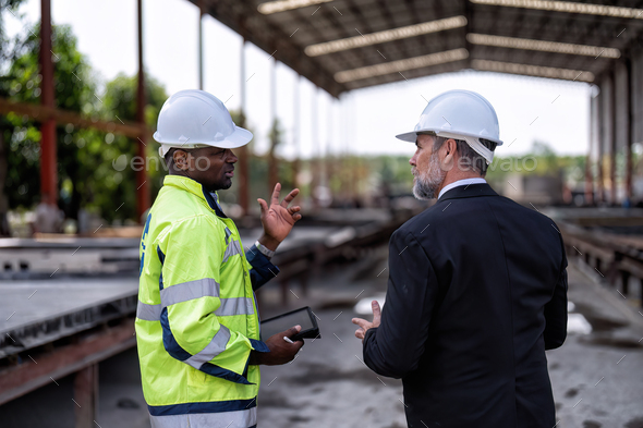 At construction site manager meet engineer check precast concrete slabs ...