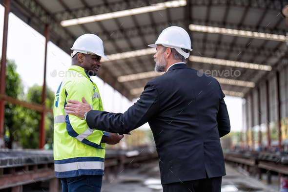 At construction site manager meet engineer check precast concrete slabs ...