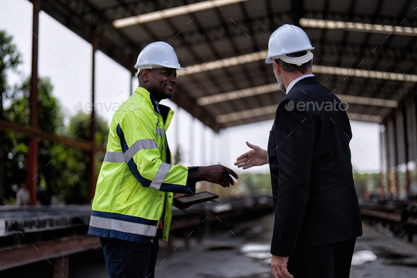 At construction site manager meet engineer check precast concrete slabs ...