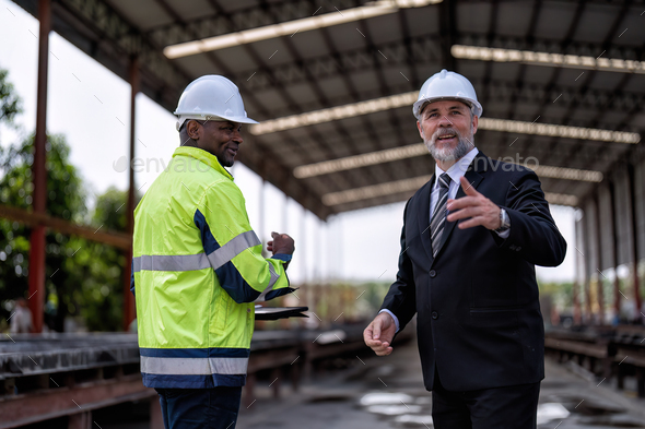 At construction site manager meet engineer check precast concrete slabs ...