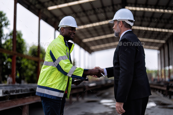 At construction site manager meet engineer check precast concrete slabs ...