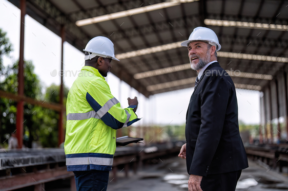 At construction site manager meet engineer check precast concrete slabs ...