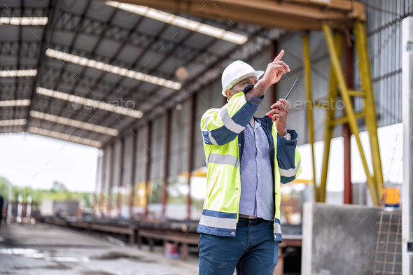 At building construction site engineer check precast concrete slabs ...