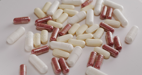 Stack of medicine on table Stock Photo by leungchopan | PhotoDune