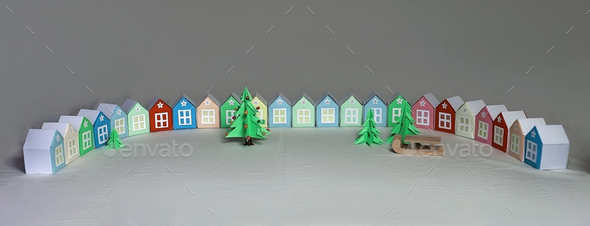 Origami advent calendar. Miniature with Christmas tree and paper houses ...